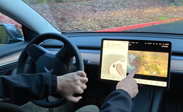 Tesla to halt games on infotainment screens in moving cars