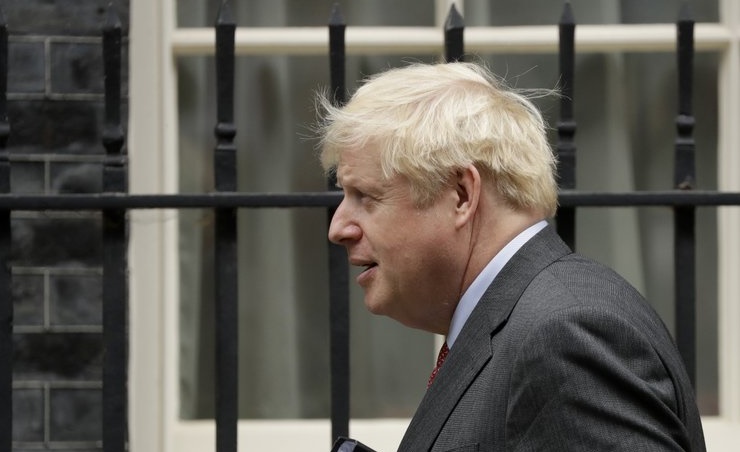 British PM unveils rules as virus cases spike