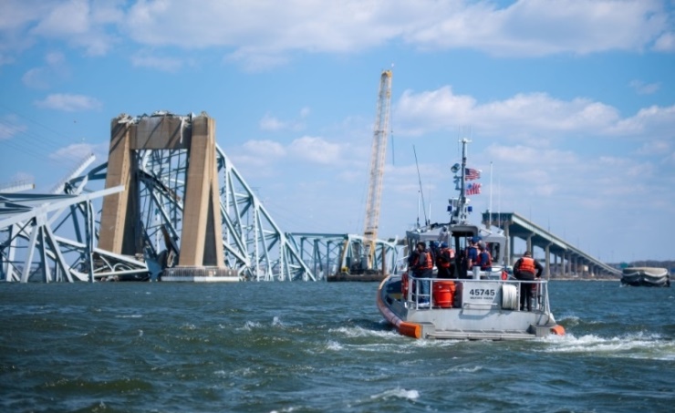 Salvage crews work to lift first piece of collapsed Baltimore bridge