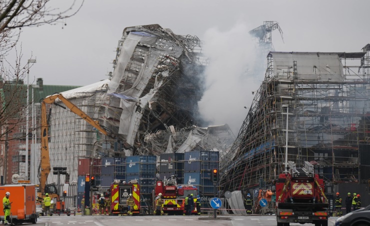 Firefighters tackle scaffolding dangling outside ruins of fire-ravaged ...